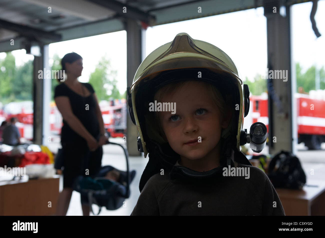 Fire engines, water hoses, nozzles and other equipment at a fire ...