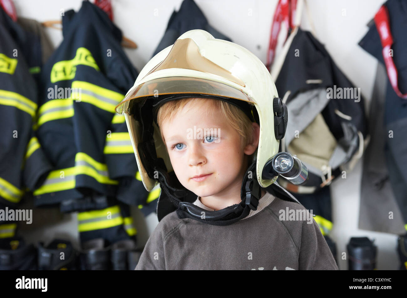 Fire engines, water hoses, nozzles and other equipment at a fire ...