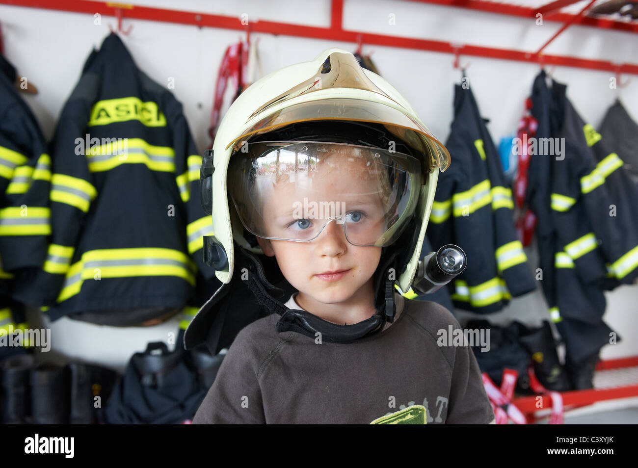 Fire engines, water hoses, nozzles and other equipment at a fire ...