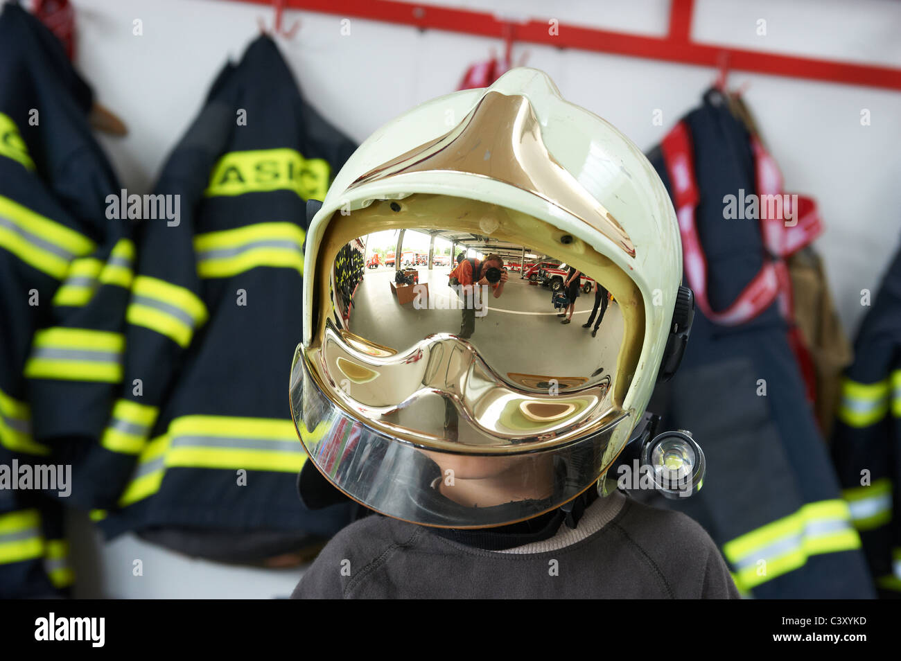Fire engines, water hoses, nozzles and other equipment at a fire ...