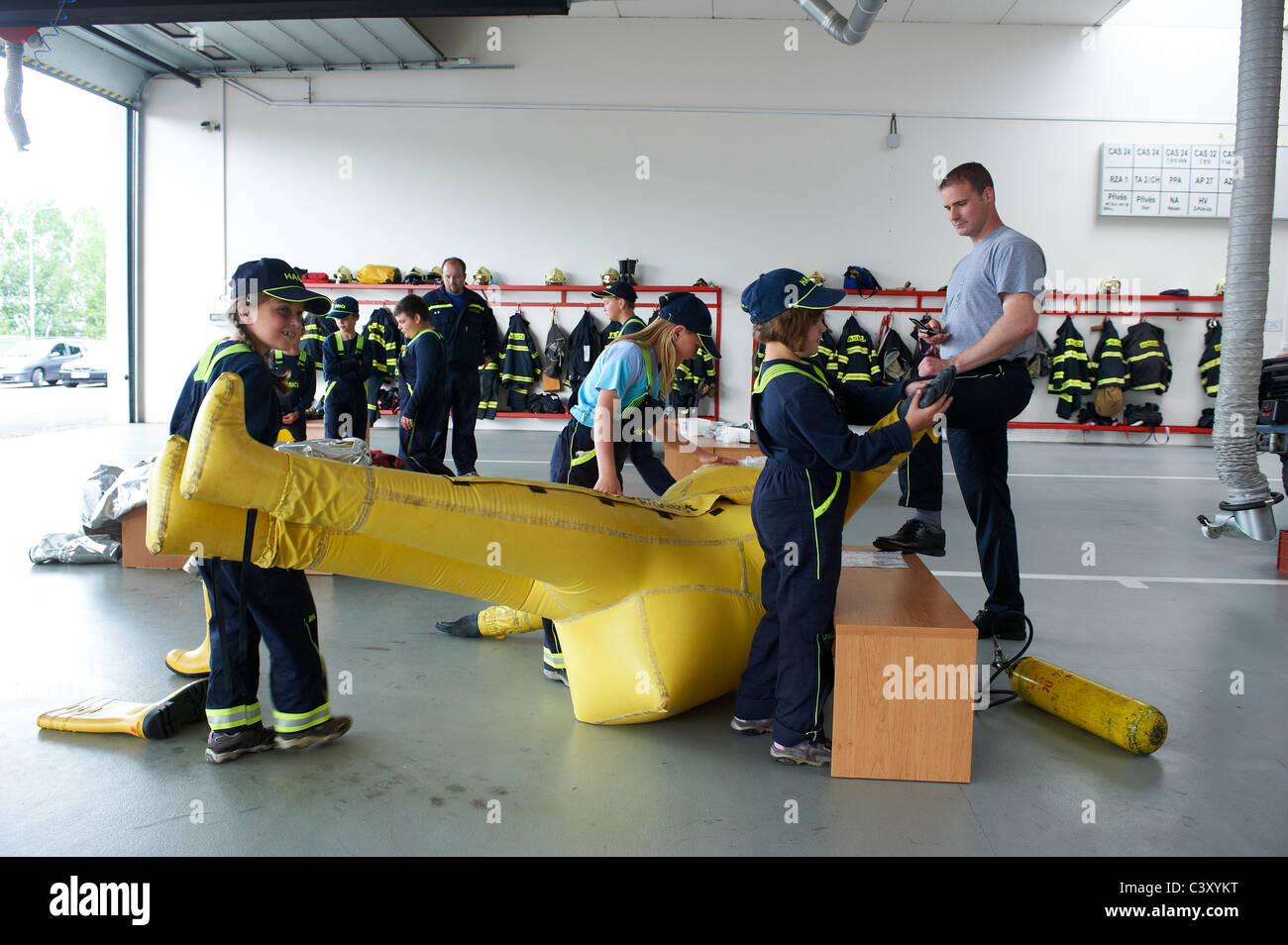 Fire engines, water hoses, nozzles and other equipment at a fire ...
