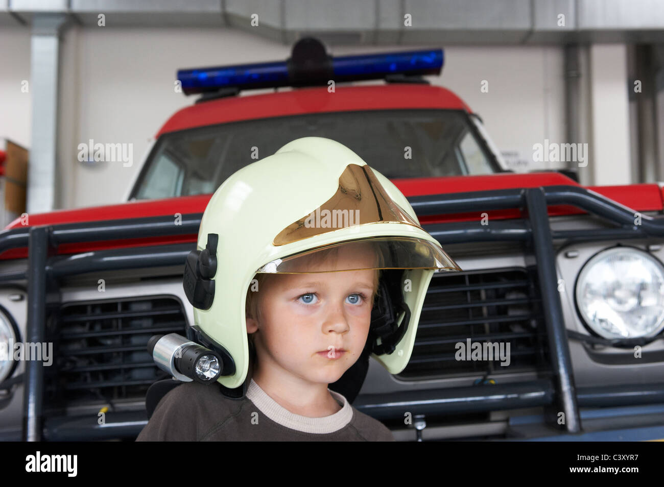 Fire engines, water hoses, nozzles and other equipment at a fire ...