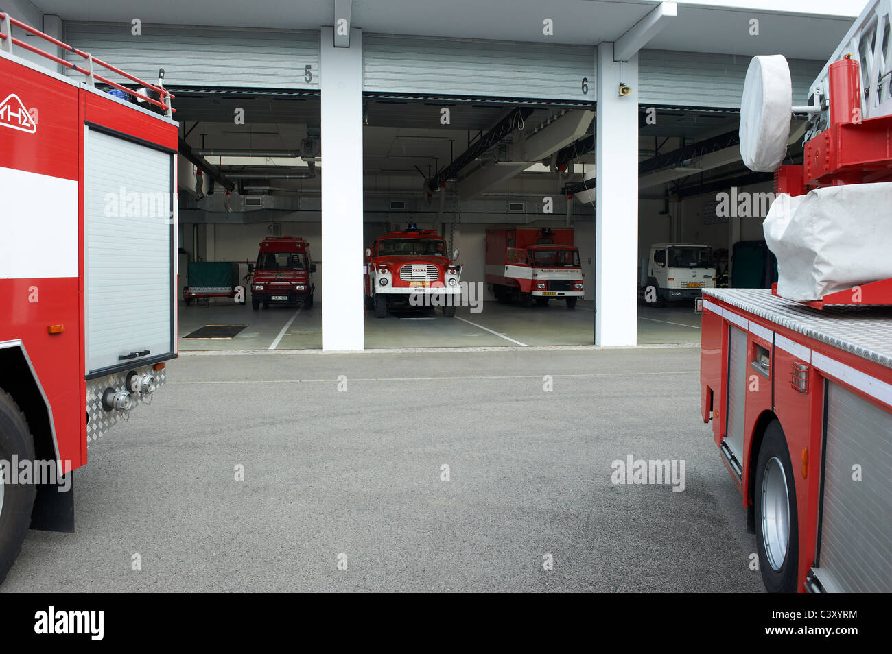 Fire engines, water hoses, nozzles and other equipment at a fire ...