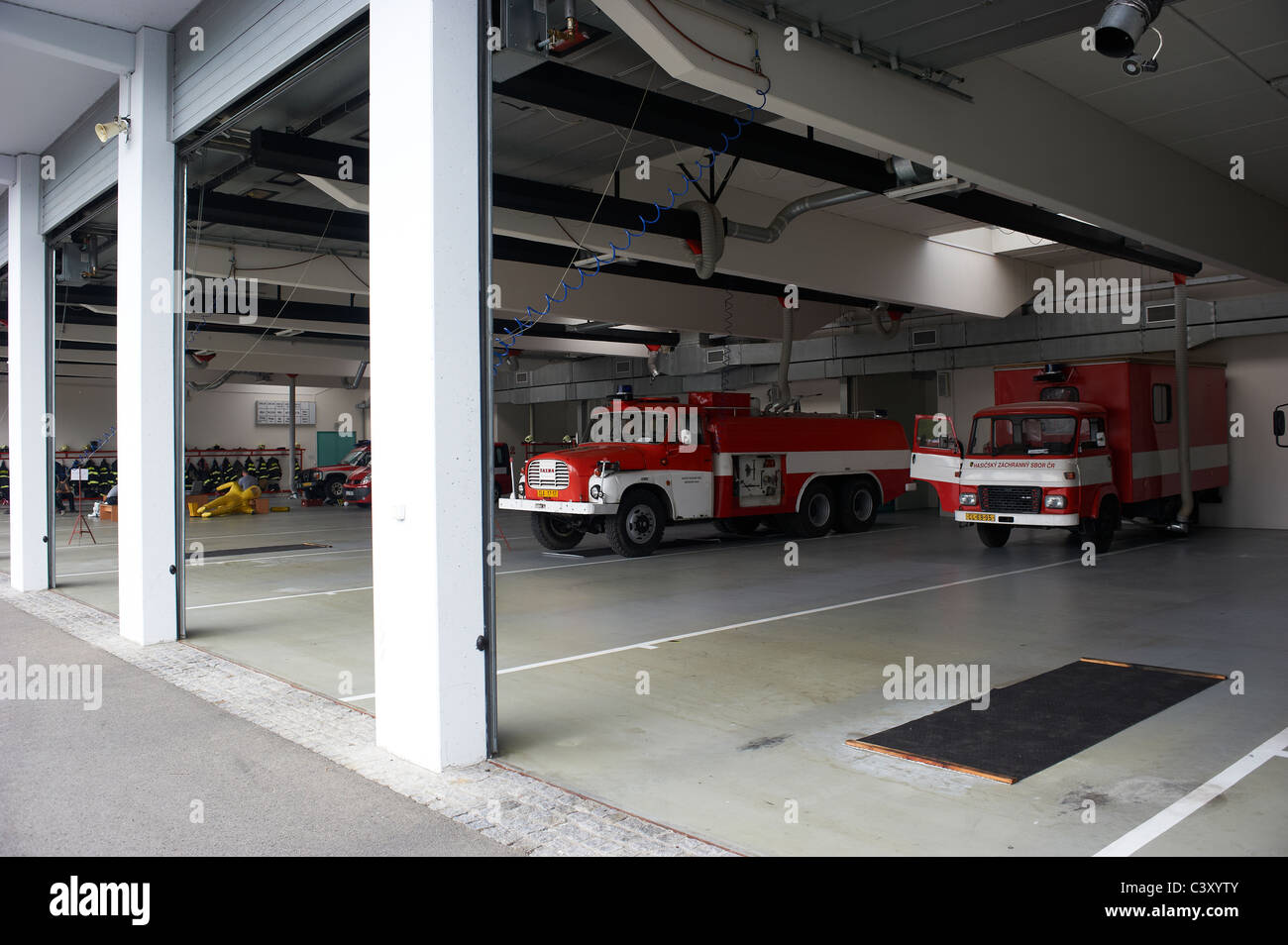 Fire engines, water hoses, nozzles and other equipment at a fire ...