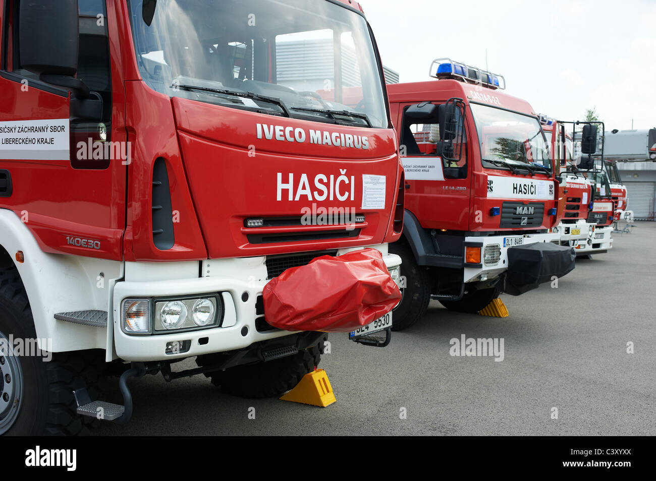 Fire engines, water hoses, nozzles and other equipment at a fire ...