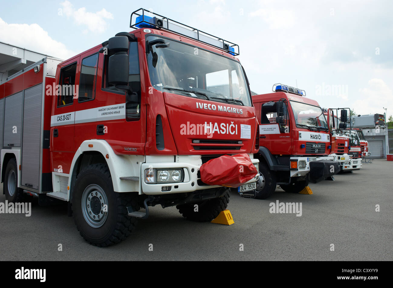 Fire engines, water hoses, nozzles and other equipment at a fire ...