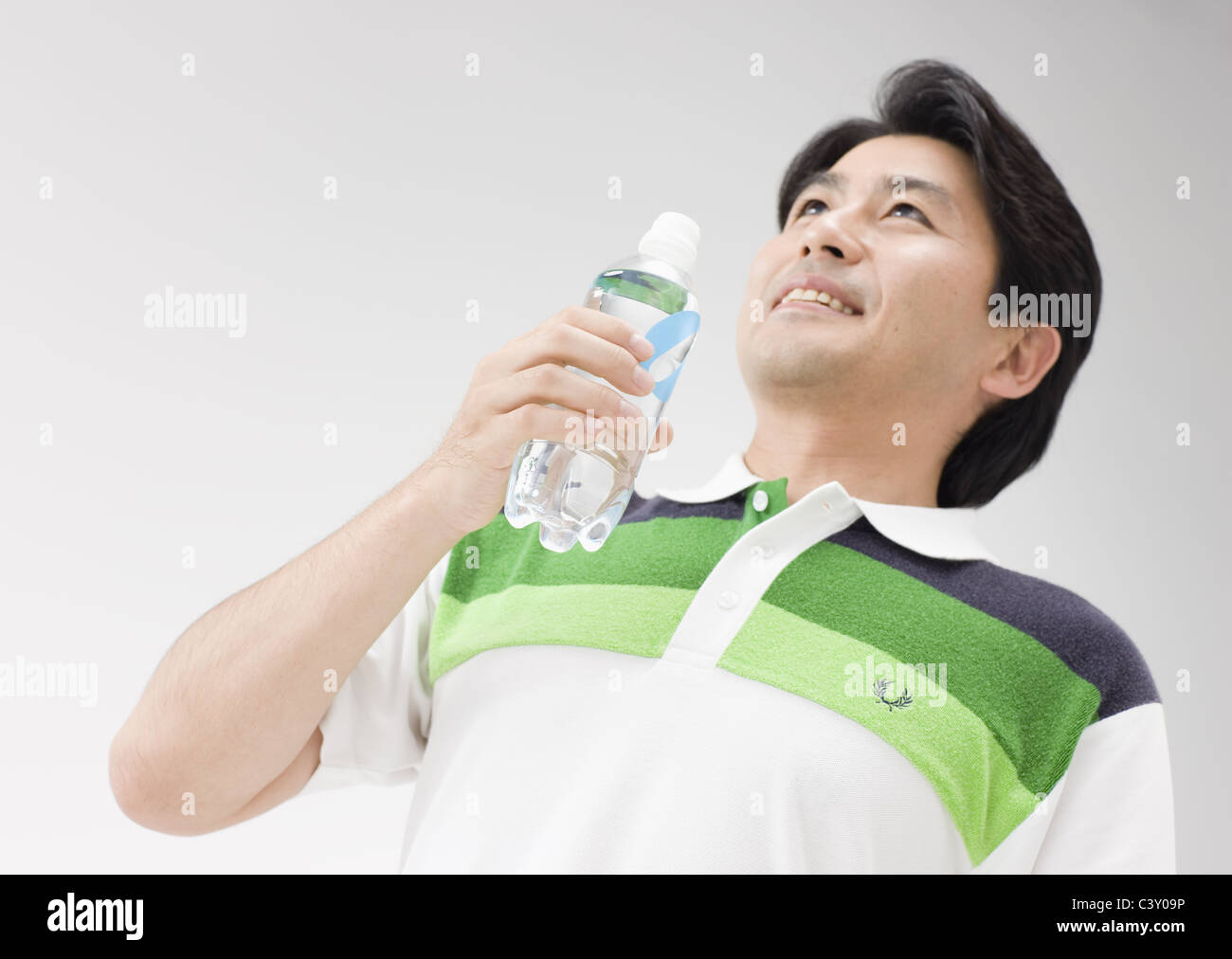 Man holding plastic bottle Stock Photo - Alamy