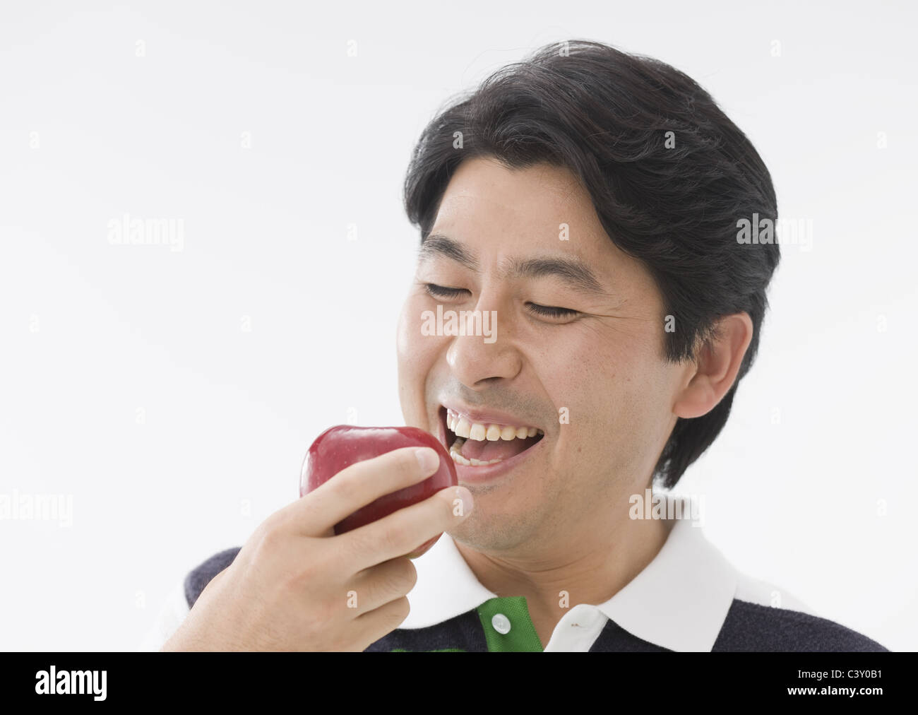 Man eating apple Stock Photo - Alamy