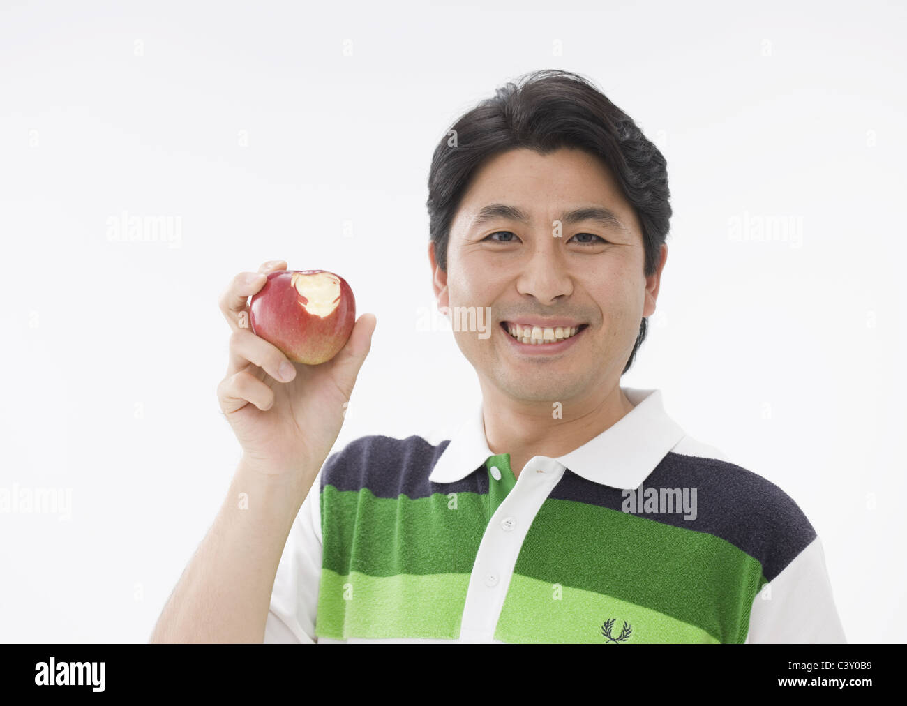 Man holding apple Stock Photo - Alamy