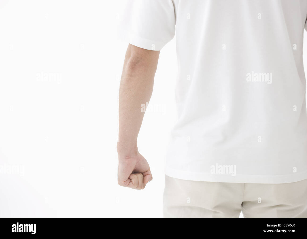Man clenching fist Stock Photo - Alamy