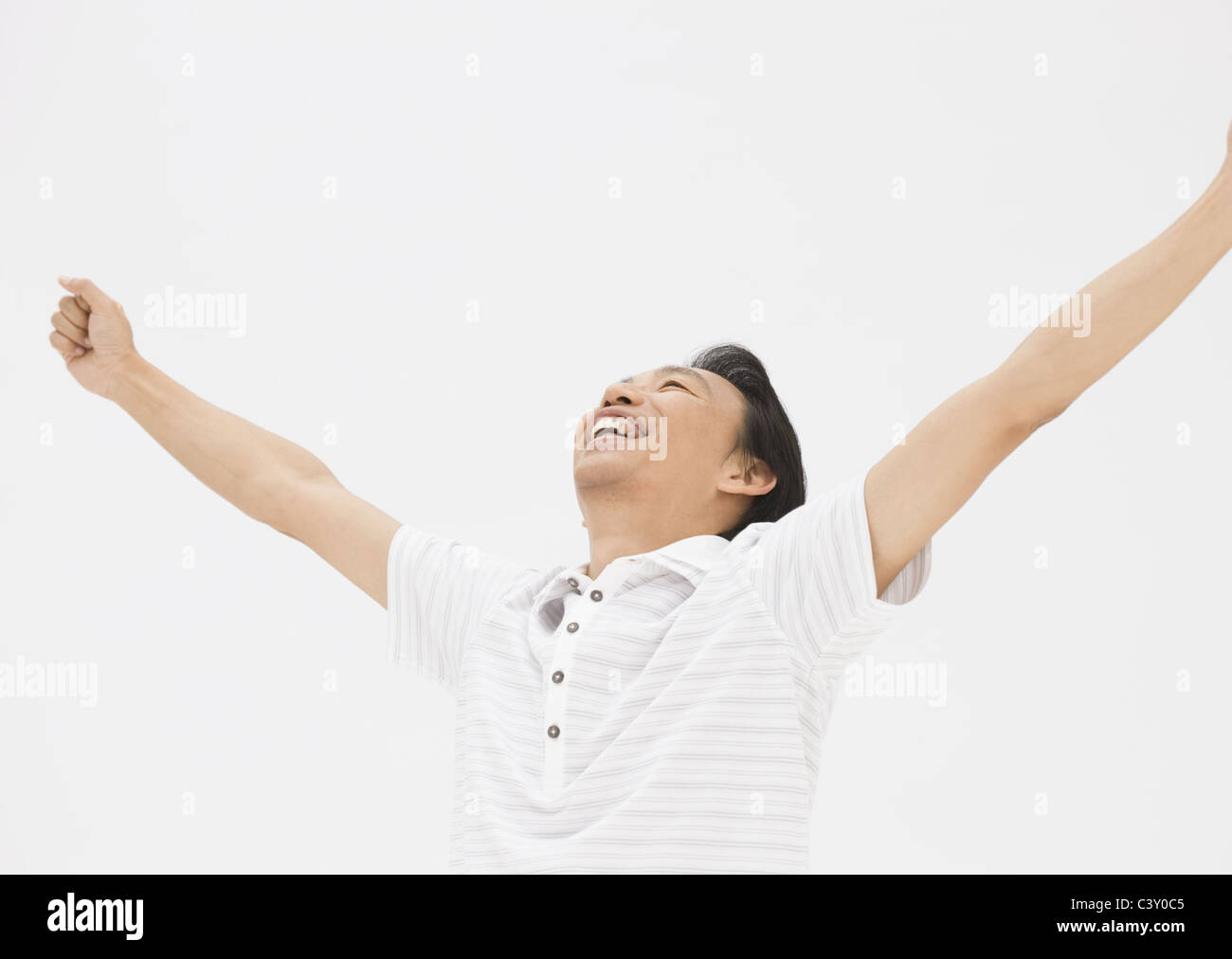 Man with his hands up Stock Photo - Alamy