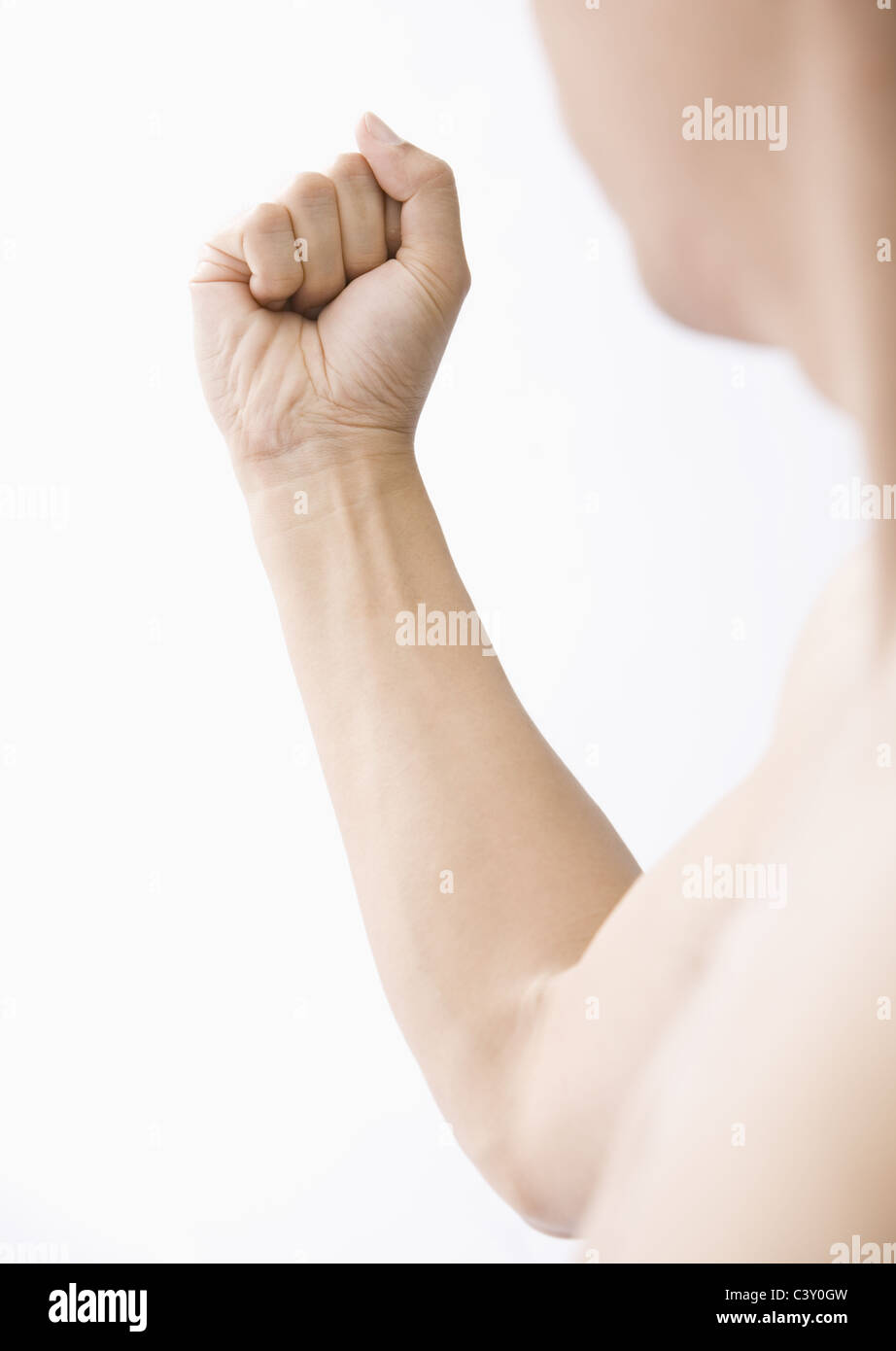 Man clenching fist Stock Photo - Alamy