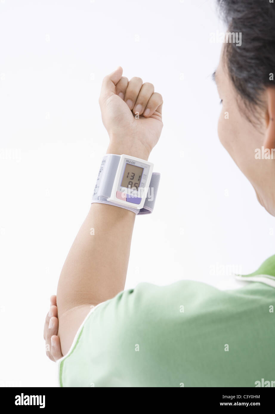 Man measuring his blood pressure Stock Photo - Alamy