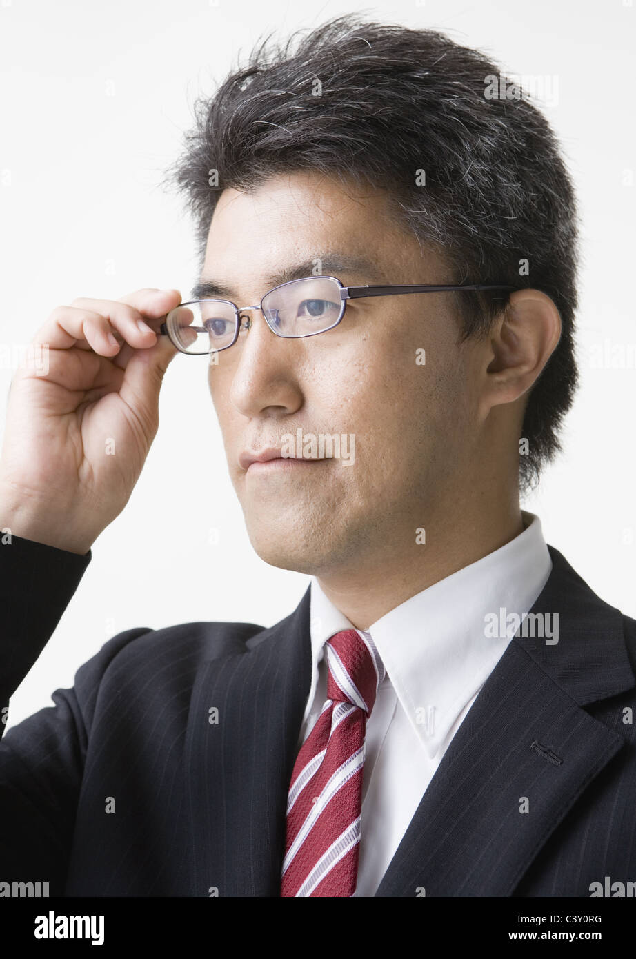 Businessman wearing glasses Stock Photo - Alamy