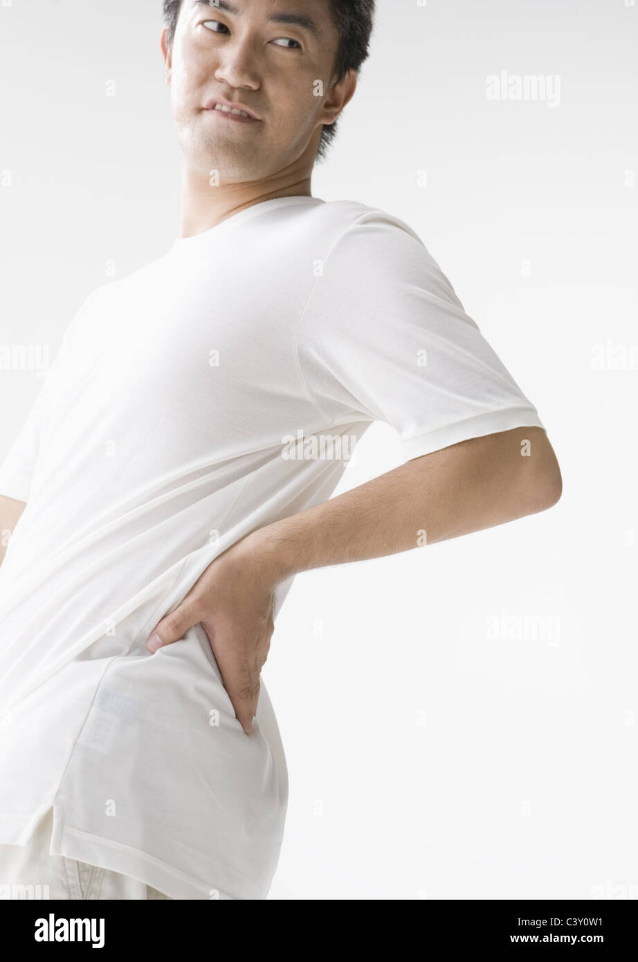 Man with hand on hip Stock Photo - Alamy