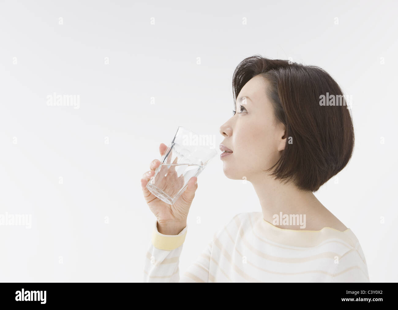 Woman drinking water Stock Photo - Alamy
