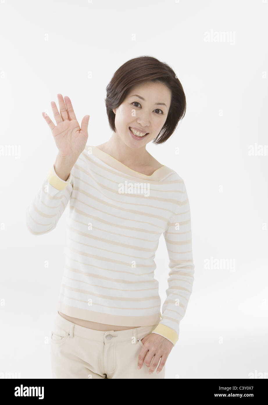 Woman standing in front of wave hi-res stock photography and images - Alamy