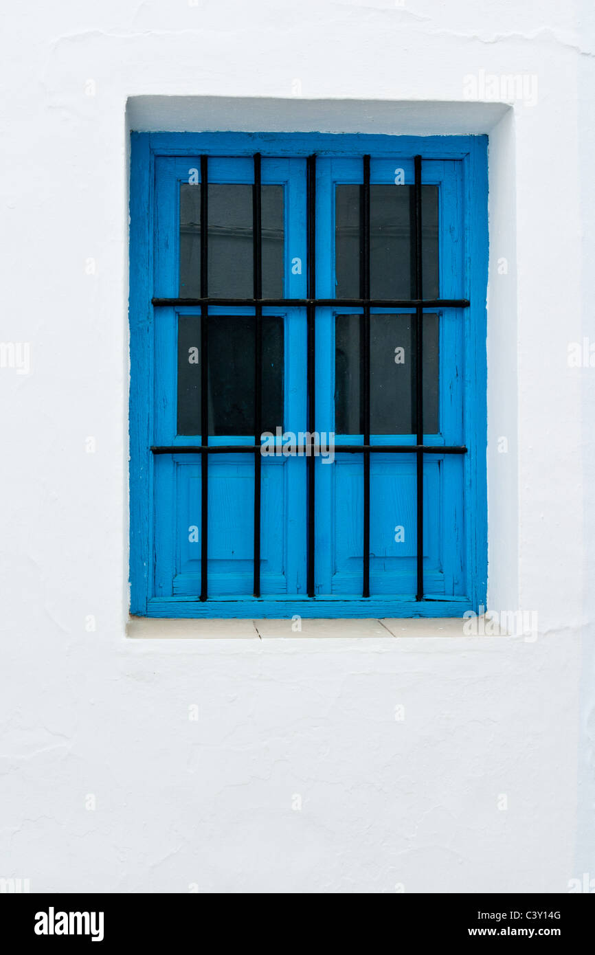 Blue window in white wall Stock Photo - Alamy
