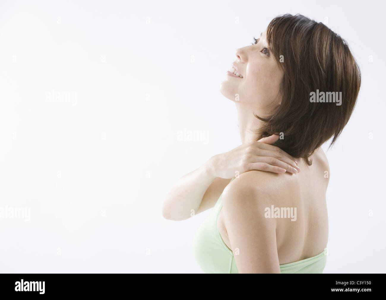 Woman with hand on shoulder Stock Photo - Alamy