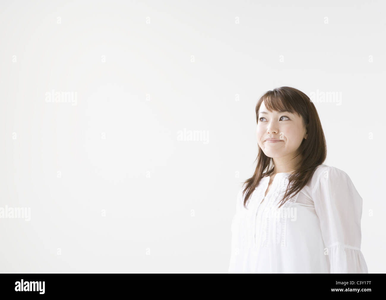 Woman with sideways glance Stock Photo - Alamy