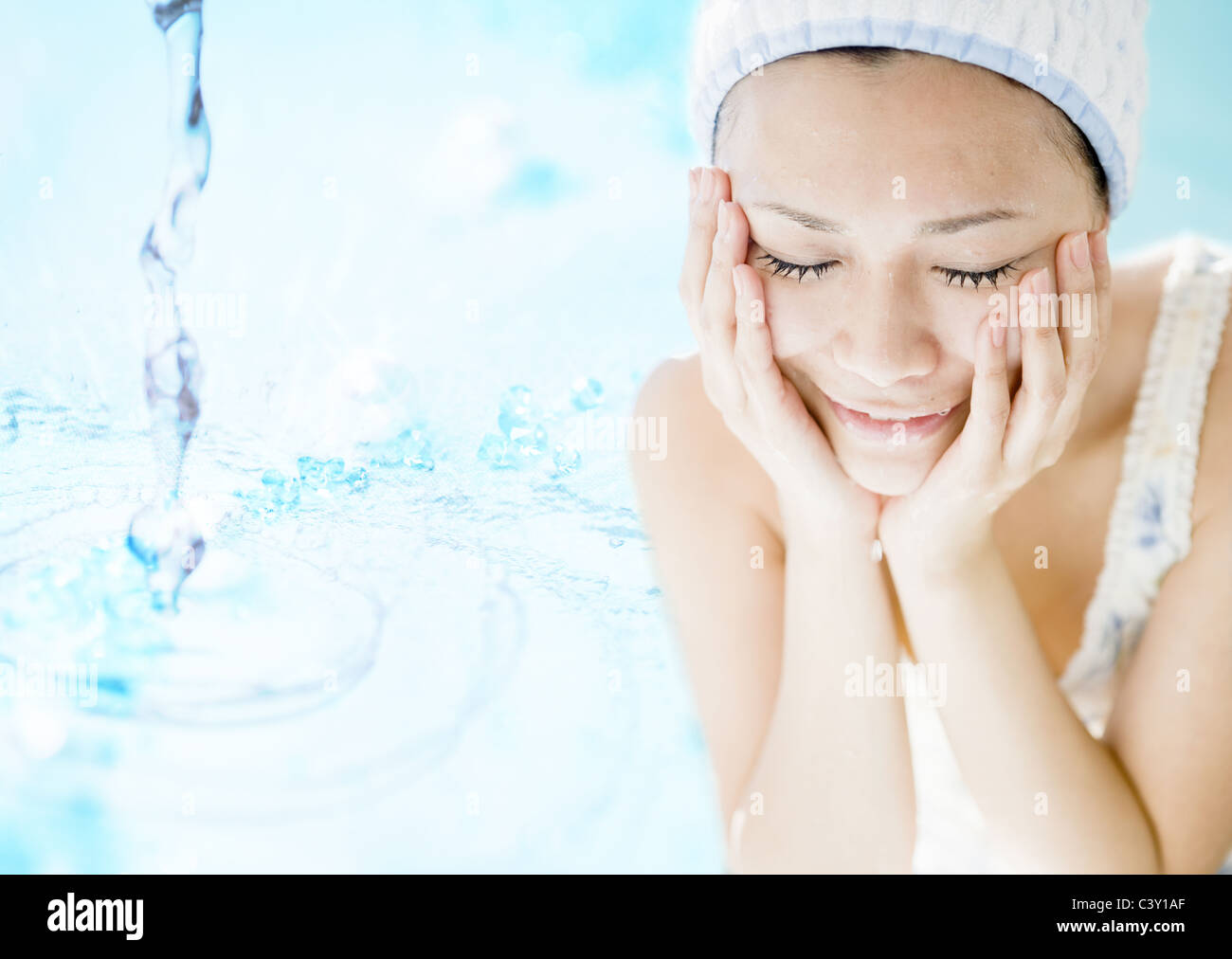 Young woman washing face Stock Photo - Alamy