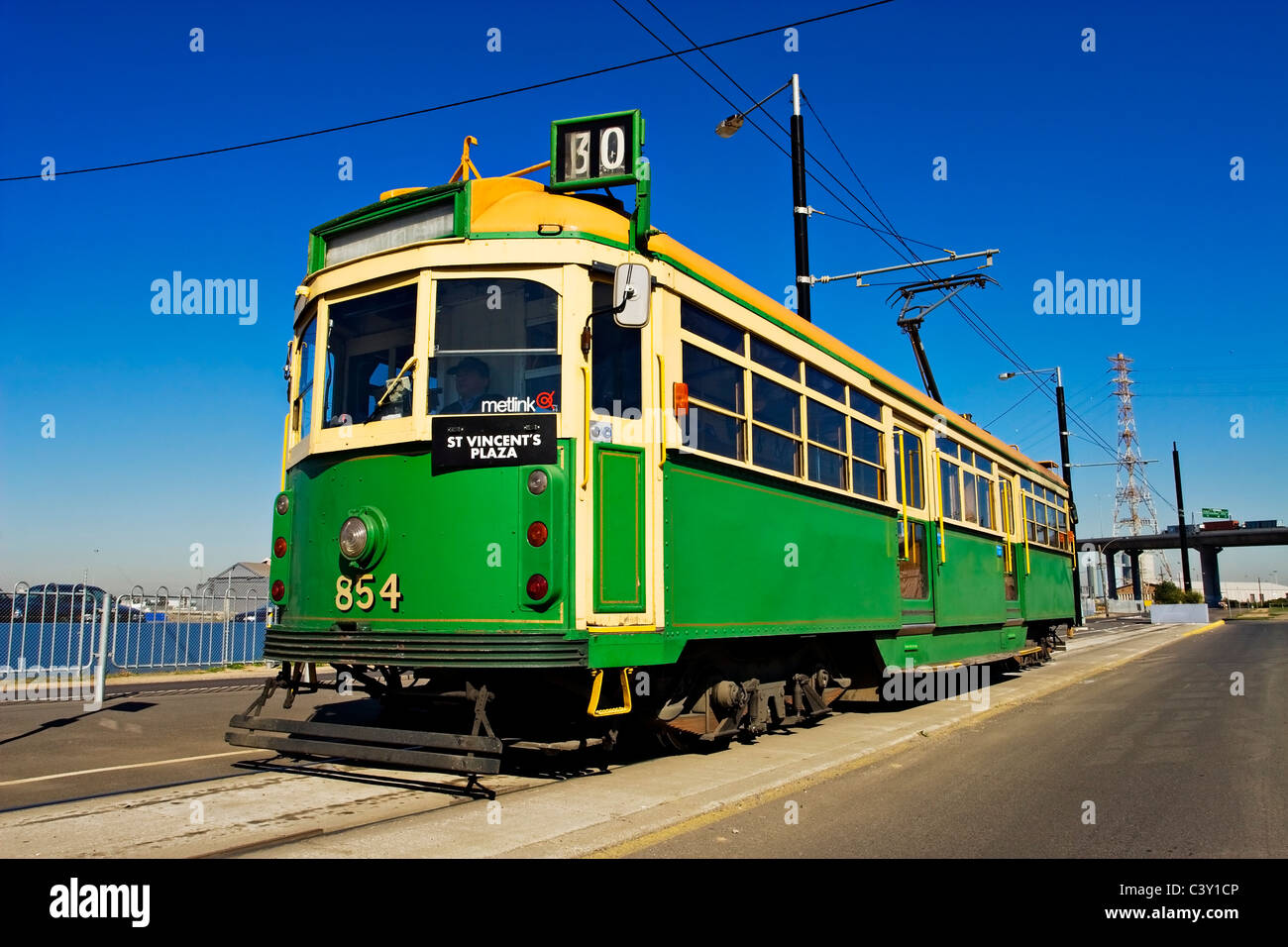 Melbourne Australia / A classic older model tram traveling through the ...
