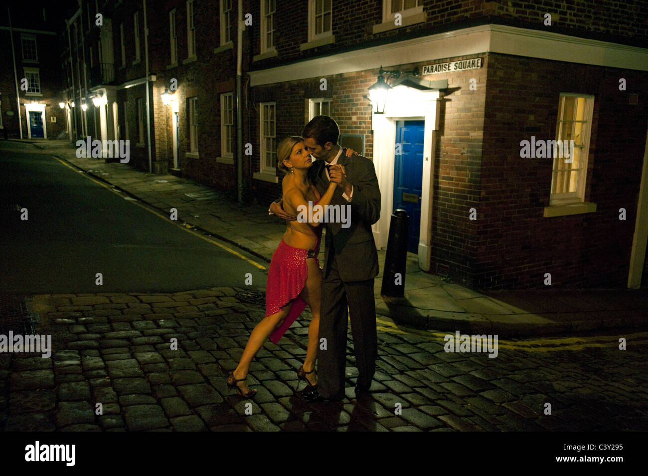 2 Tango dancers at night in Paradise Square Sheffield Stock Photo - Alamy