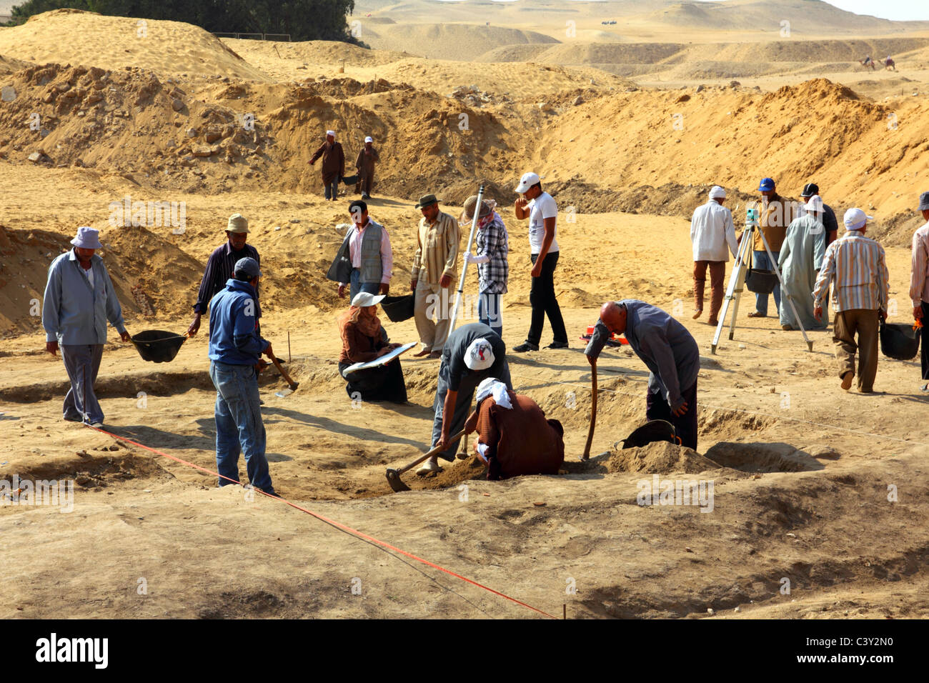 CAIRO, EGYPT - NOVEMBER 21, 2010: archaeological digging near statue of ...