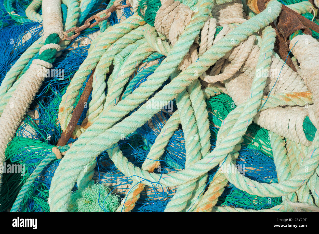 A stack of colorful fishing nets and ropes Stock Photo - Alamy