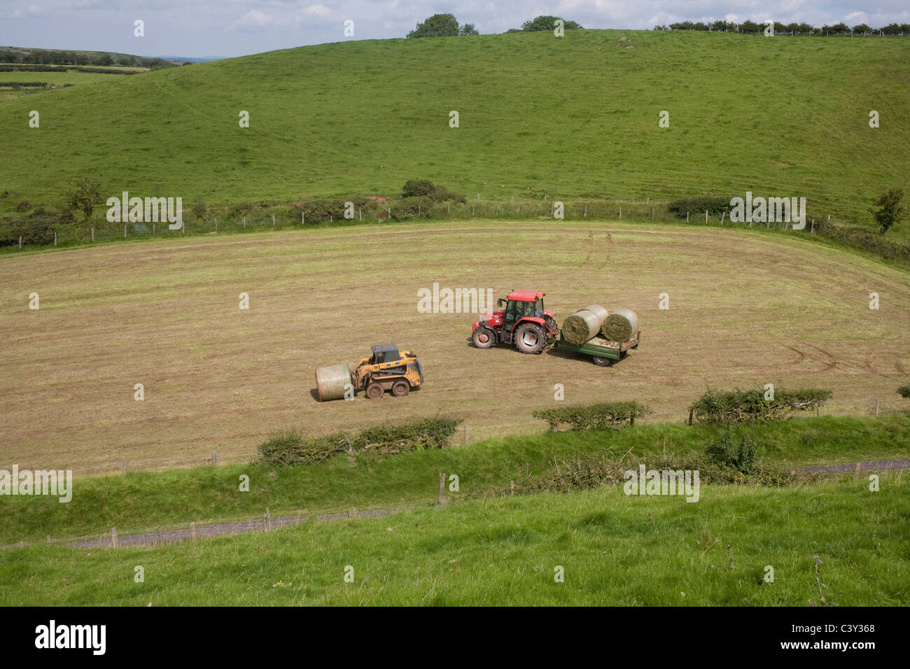 Brecon Beacons national park, Wales, tractors gathering hay harvest ...