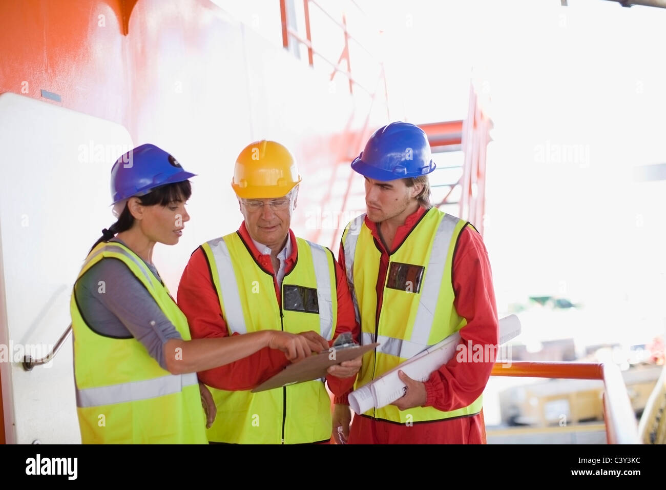 Workers reviewing the following scedule Stock Photo - Alamy Workers reviewing the following scedule Stock Photo - Alamy
