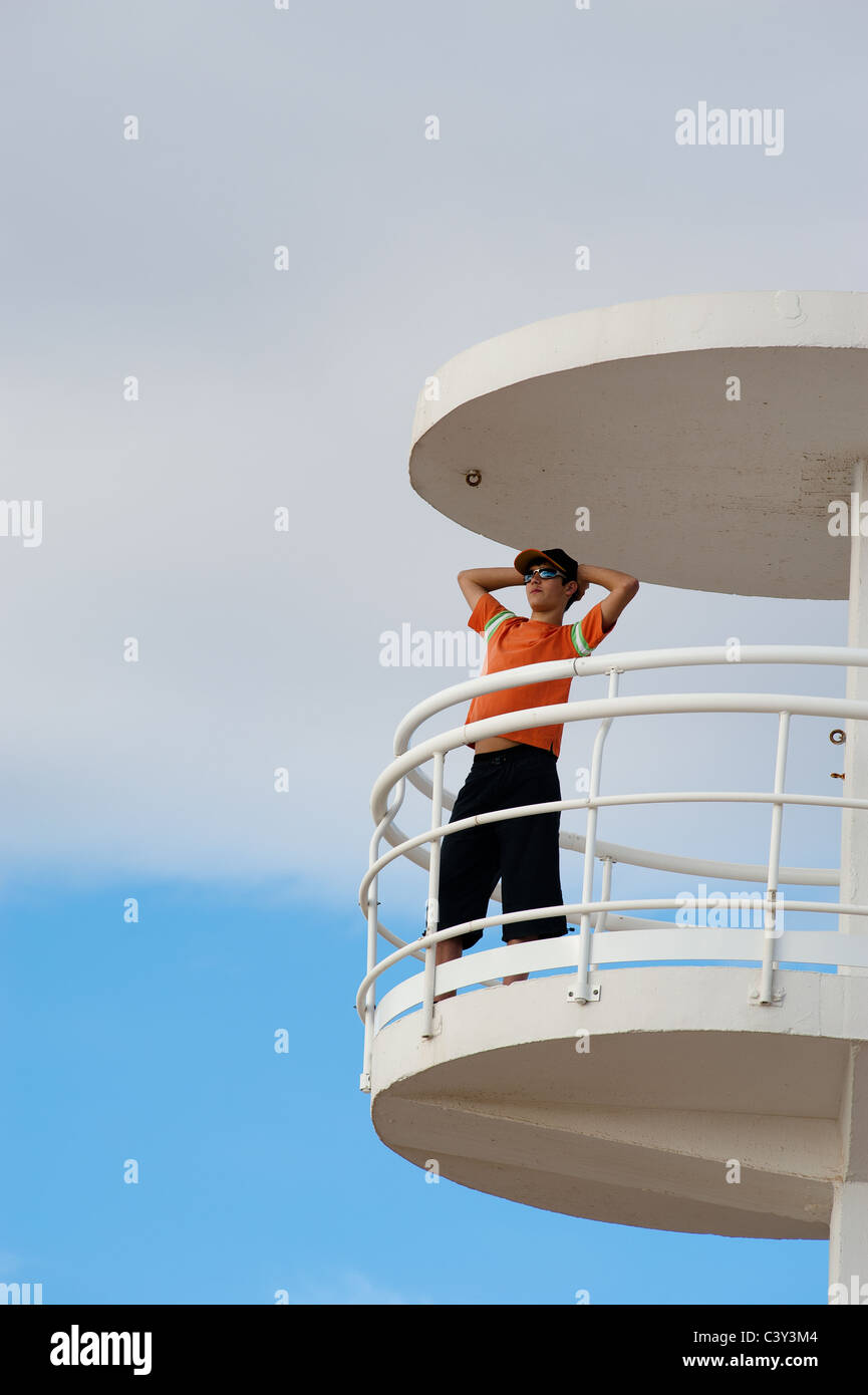 Lifeguard on duty on top of a watch-tower Stock Photo - Alamy