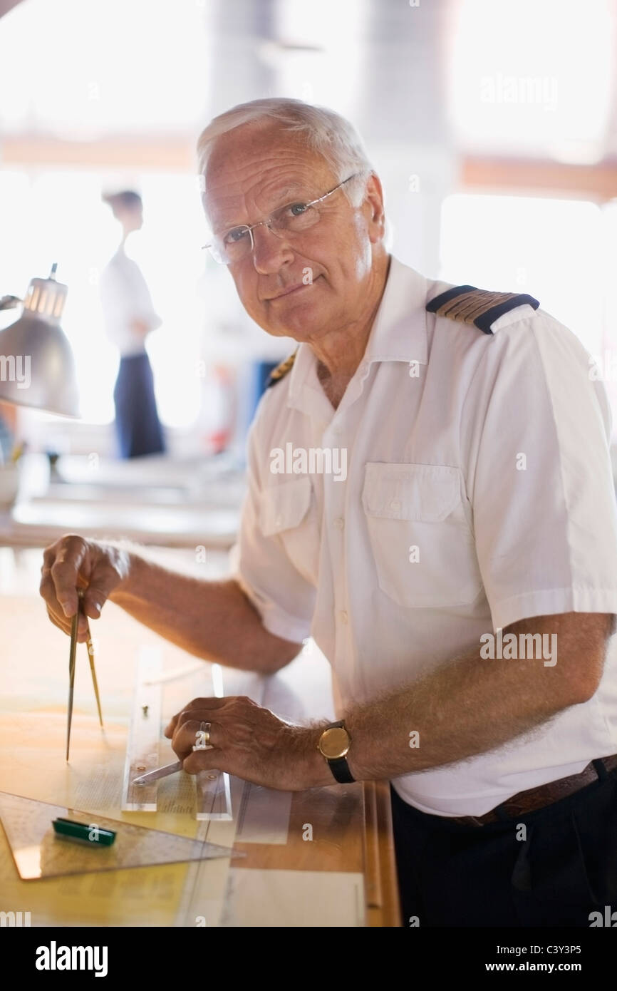 Captain setting the compasses Stock Photo - Alamy