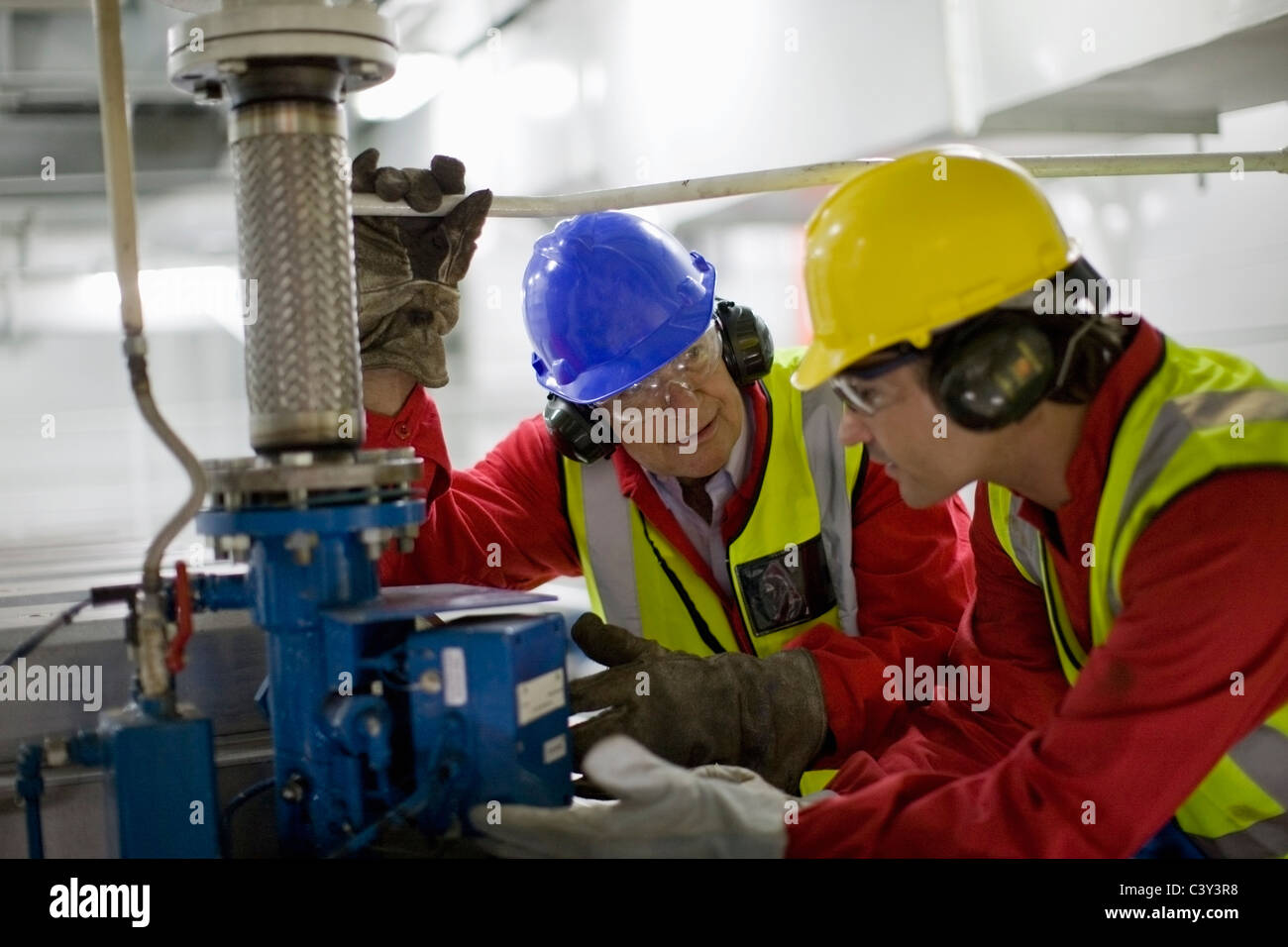 Workers doing maintenance works Stock Photo - Alamy