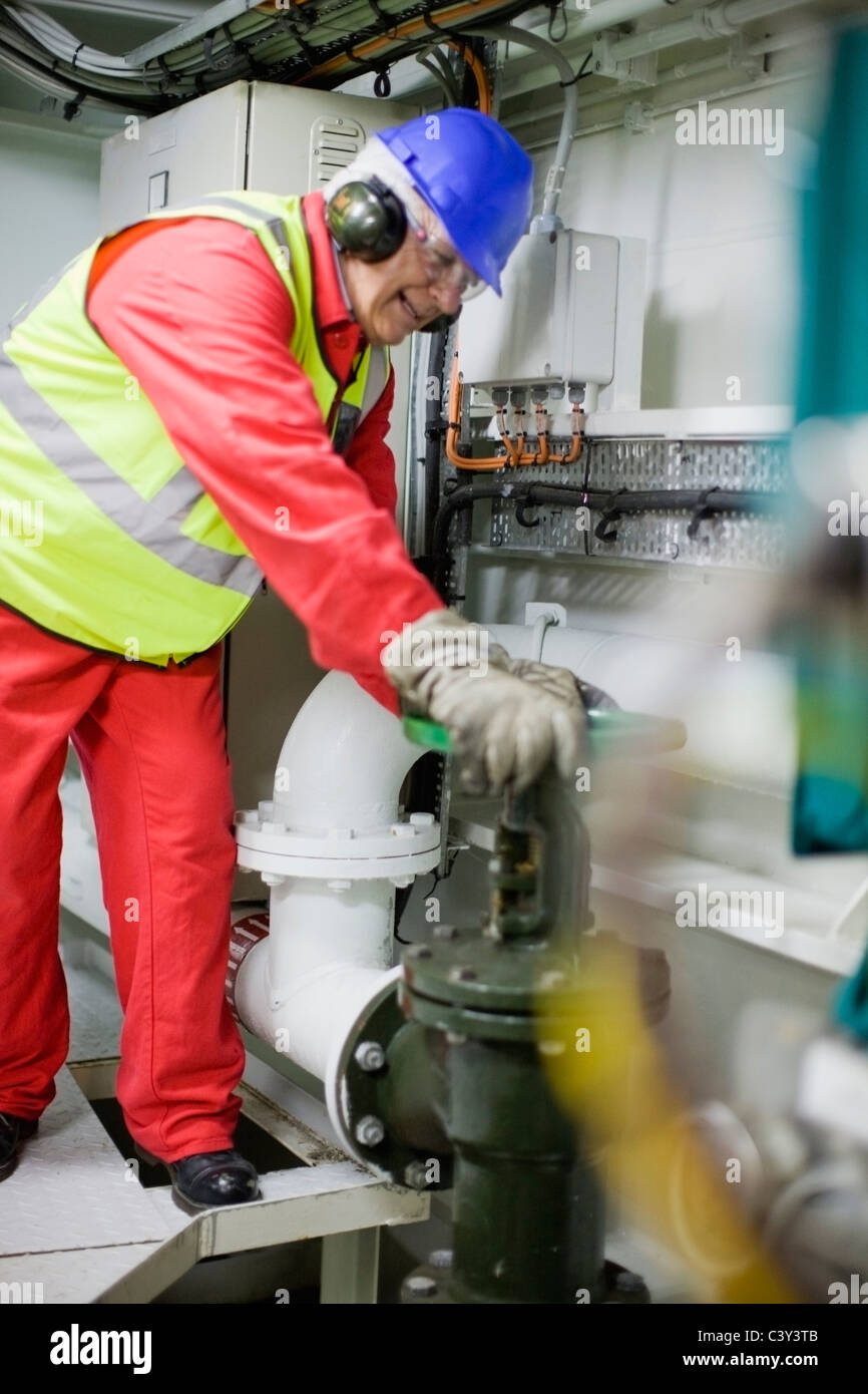 Man doing maintenance works Stock Photo - Alamy