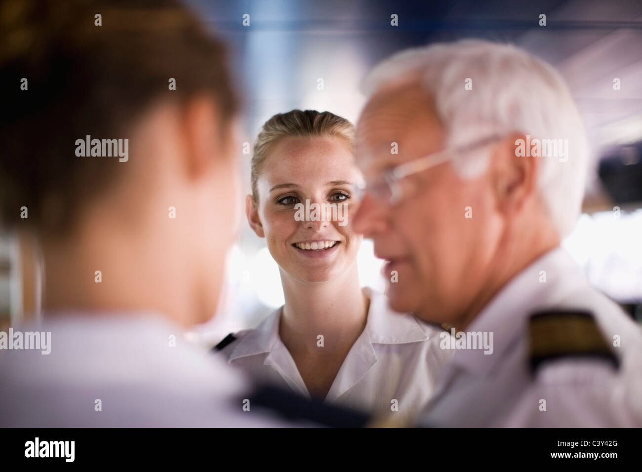 Crew of a ship talking Stock Photo - Alamy