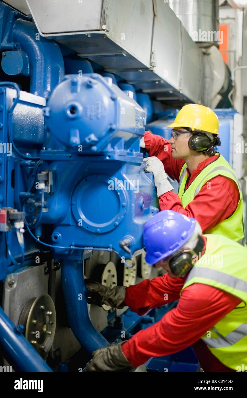 Men doing maintenance works Stock Photo - Alamy