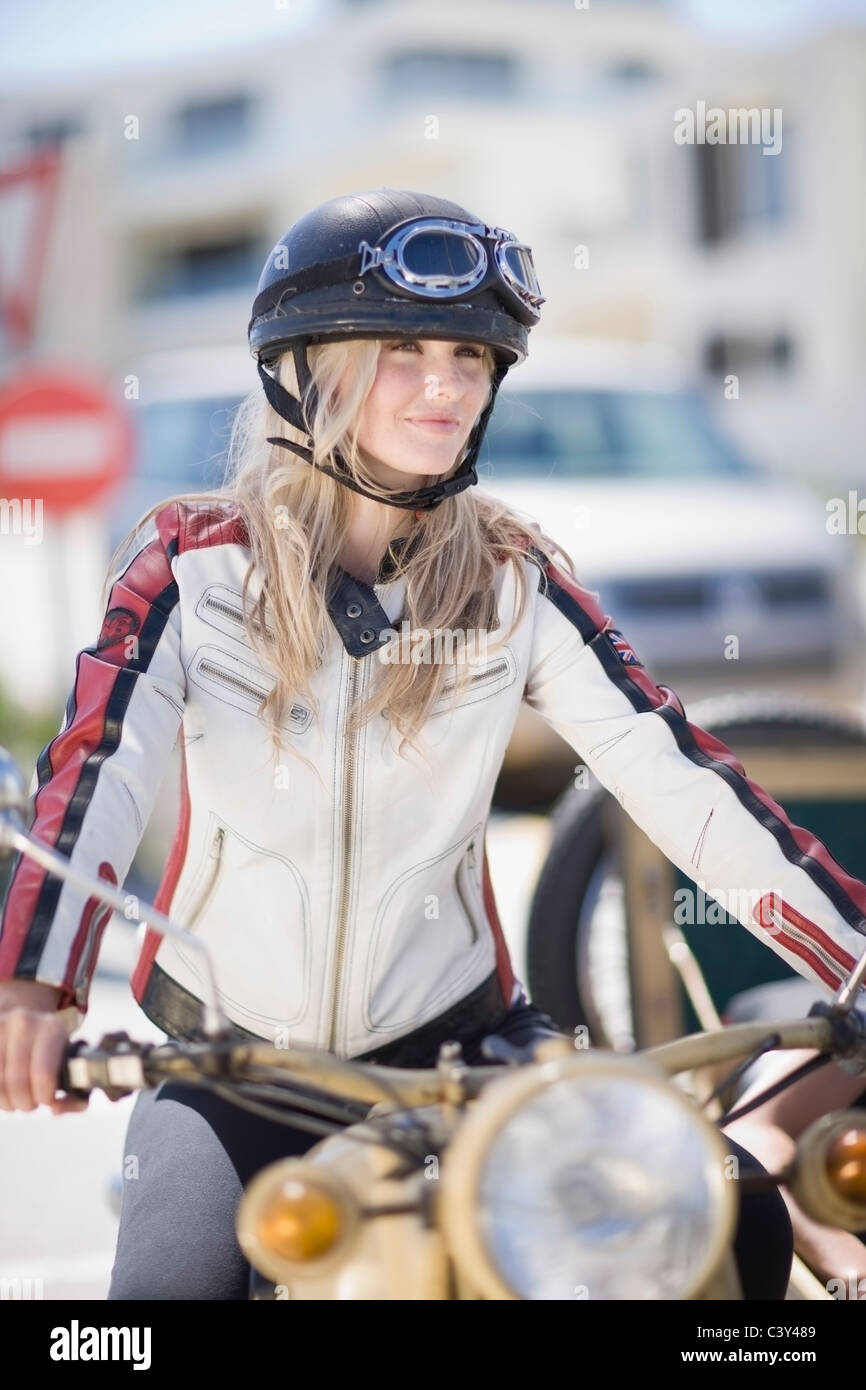 Woman riding a motorbike Stock Photo - Alamy