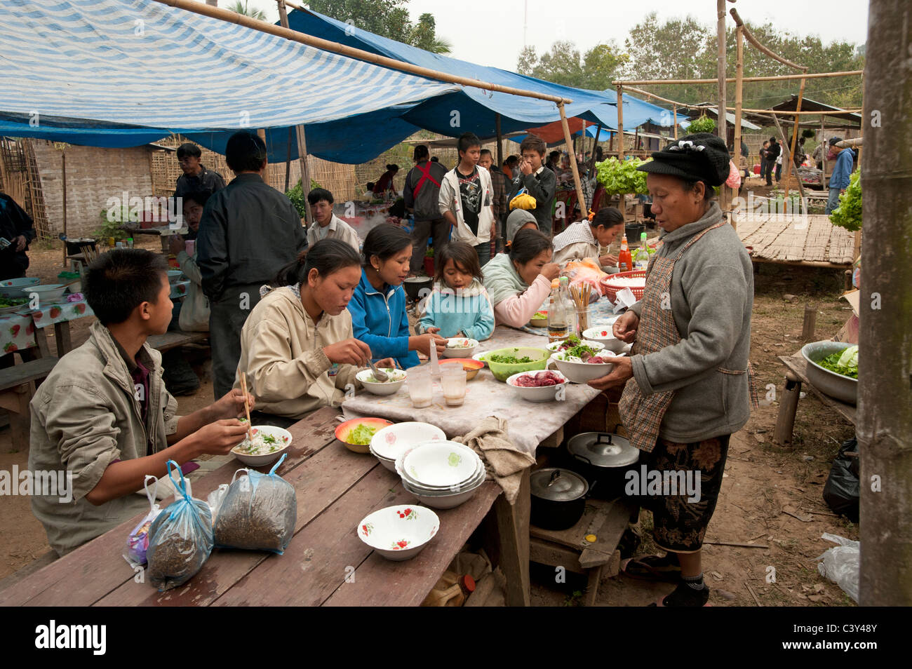 Breakfast stall in a village market in The People's Democratic Republic ...