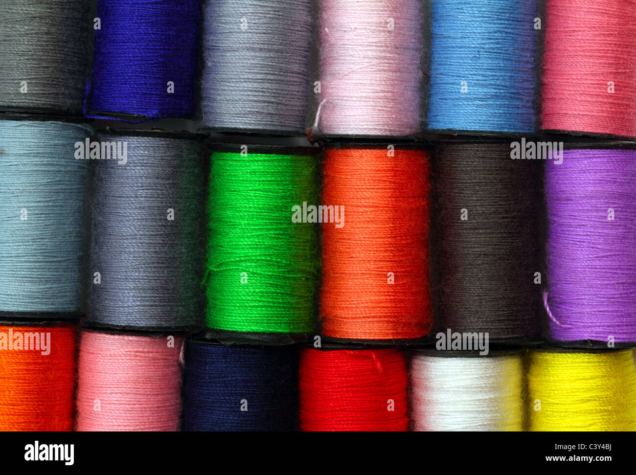 lot of colored thread spools - background Stock Photo - Alamy