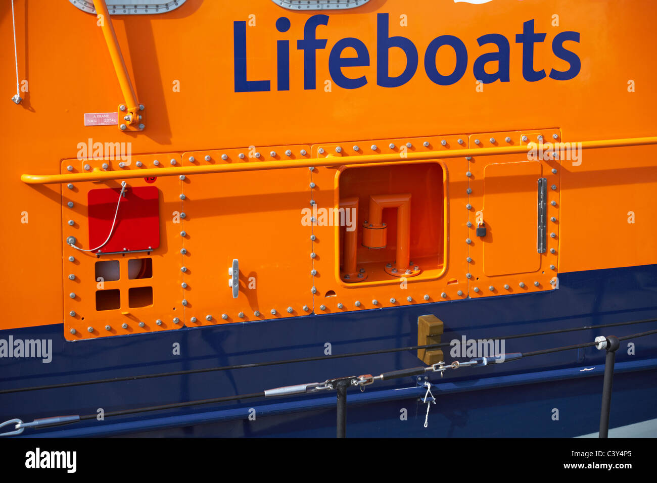 Bright orange lifeboat hi-res stock photography and images - Alamy