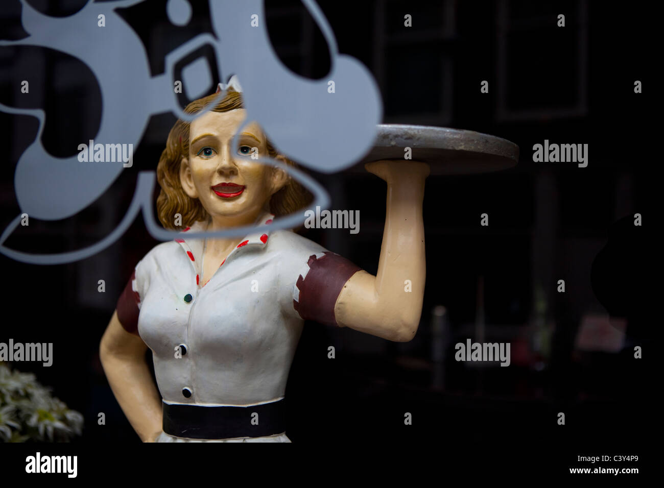 Statue of waitress in cafe window, The Hague Stock Photo - Alamy
