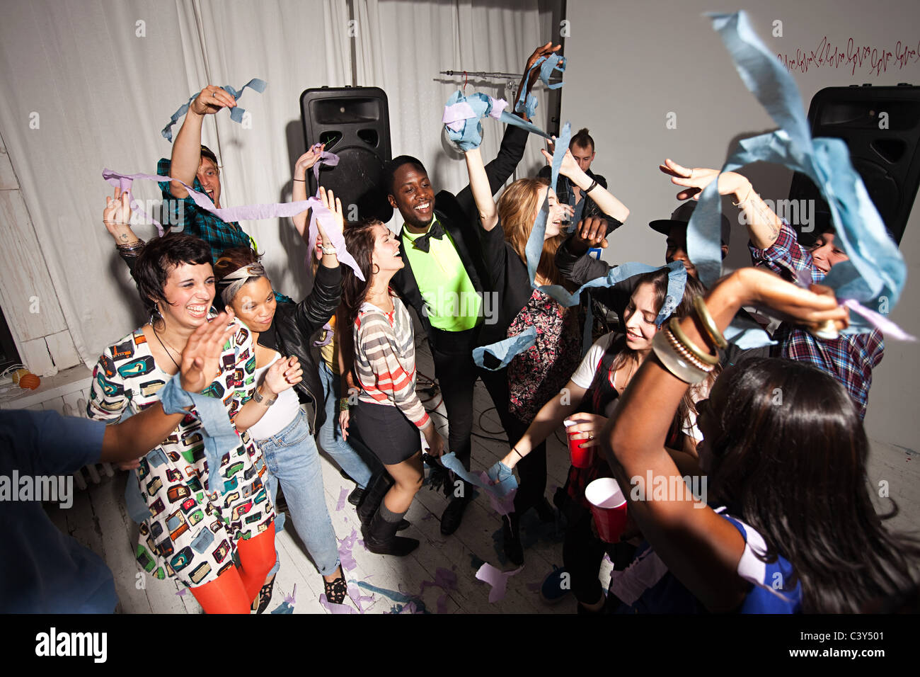 People dancing at party with streamers Stock Photo - Alamy