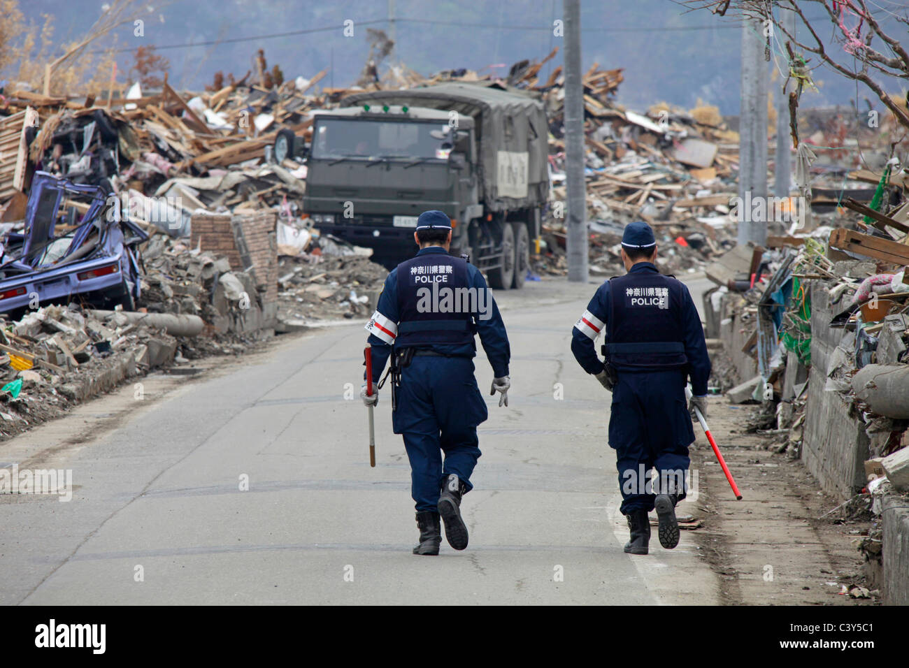 Police men on duty in devastated town after tsunami 11th March 2011 ...