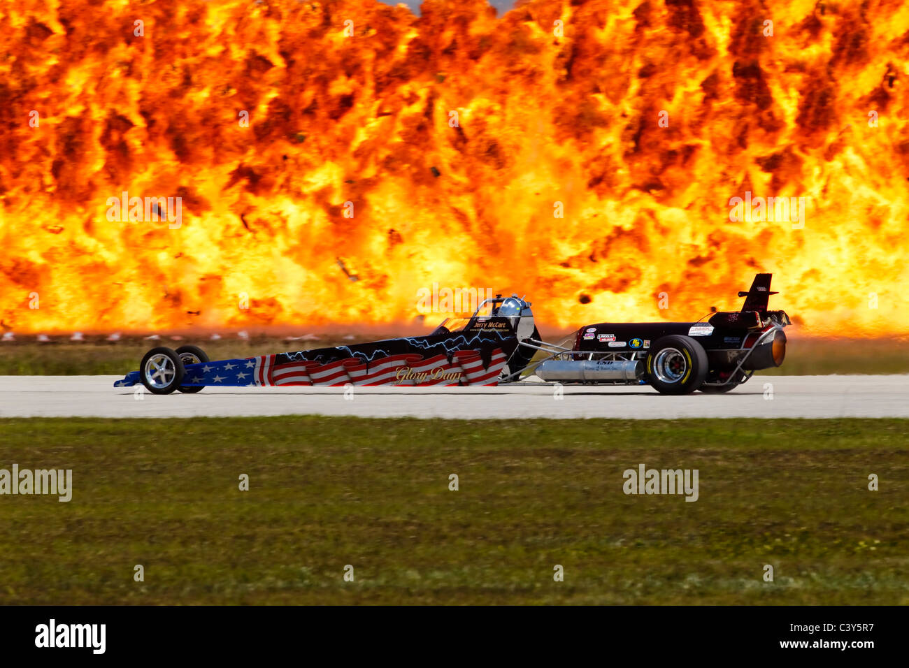 Drag racer and a wall of fire Stock Photo - Alamy