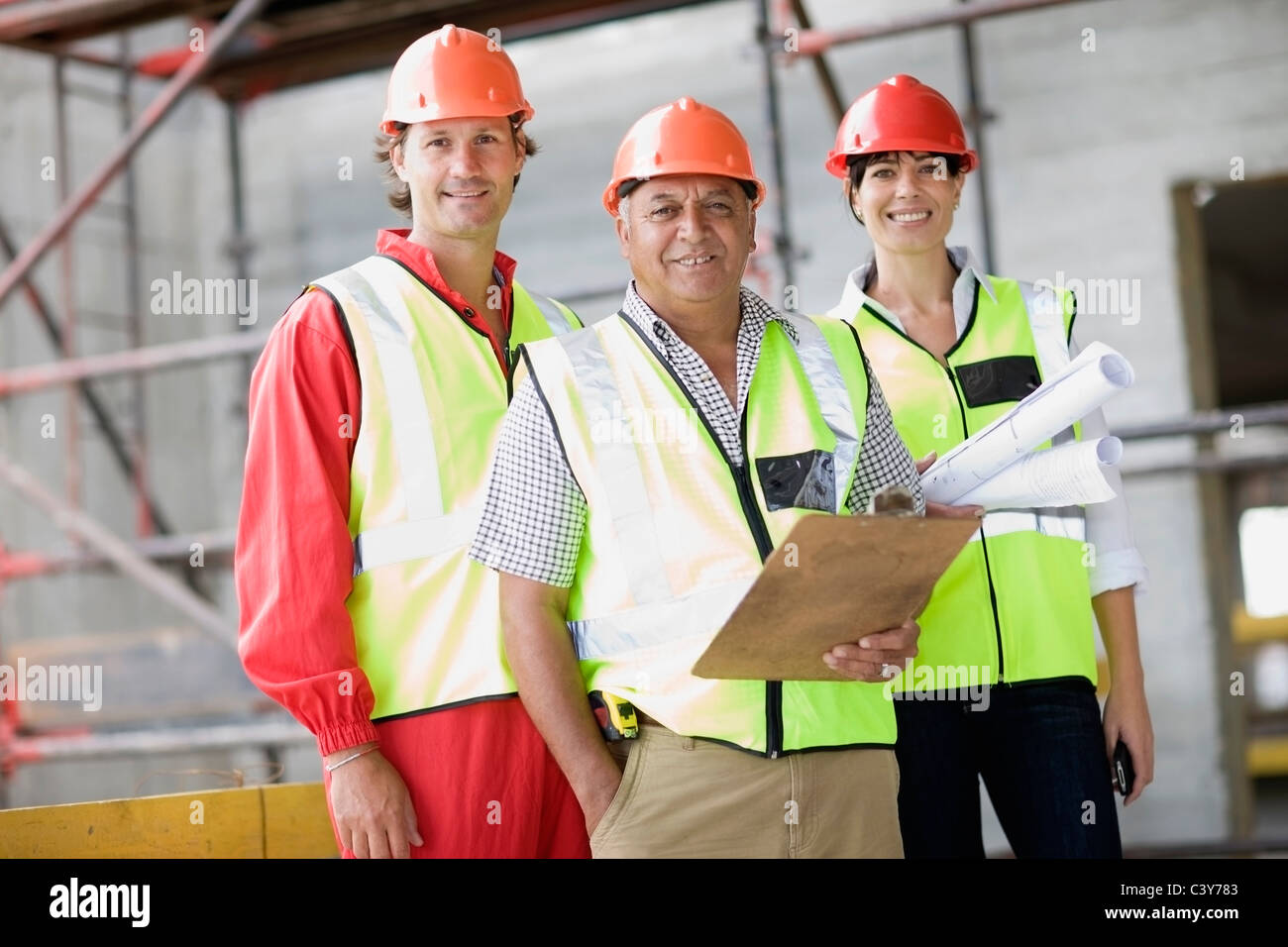 Building workers and architect Stock Photo - Alamy