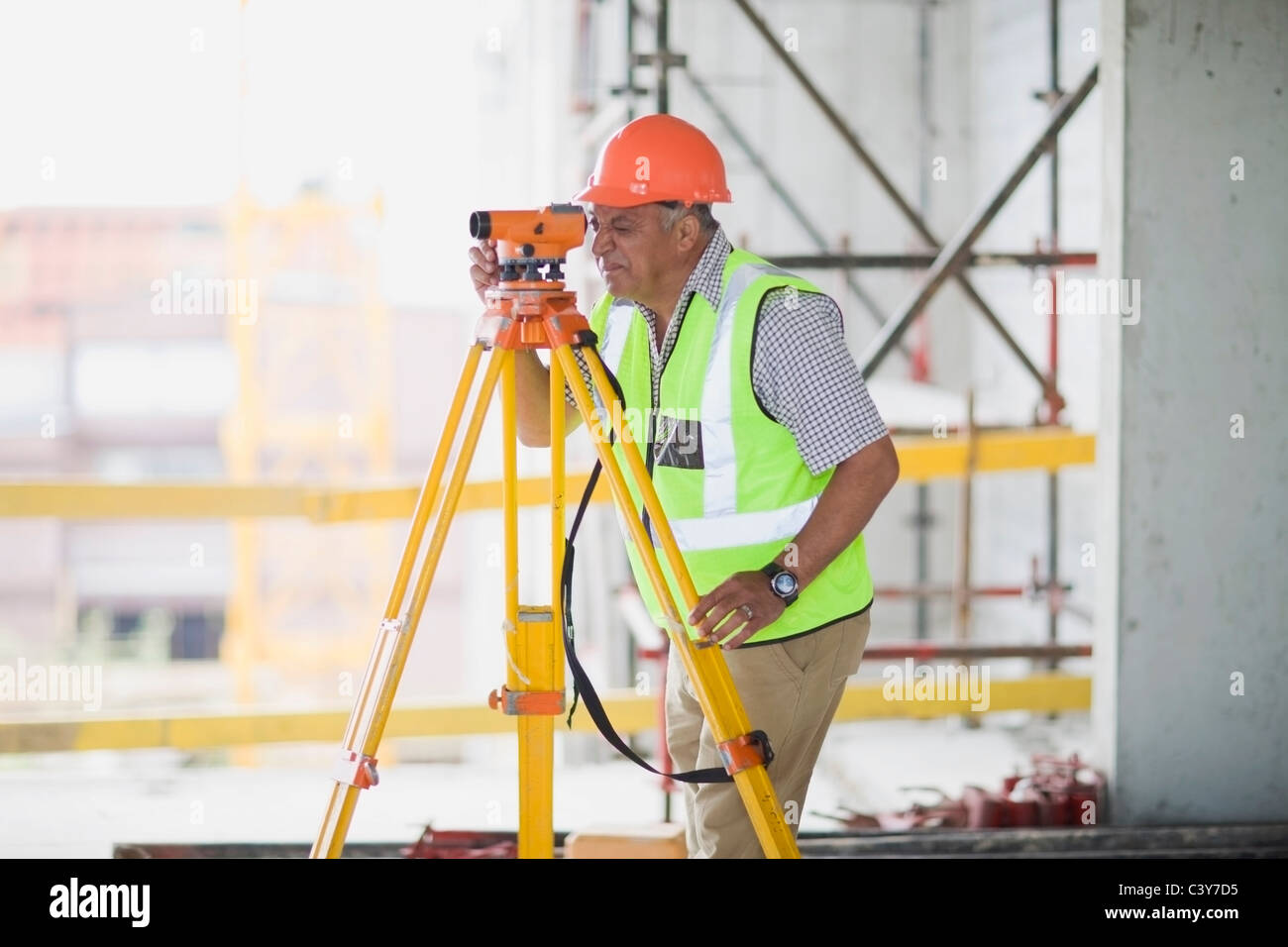 Worker with measuring equipment Stock Photo - Alamy