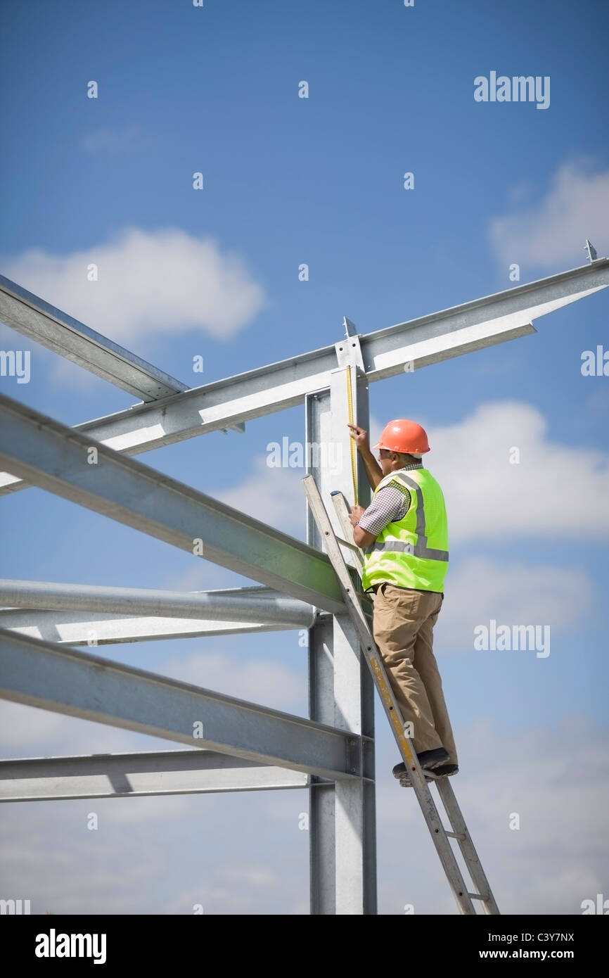Worker inspecting a building plot Stock Photo - Alamy