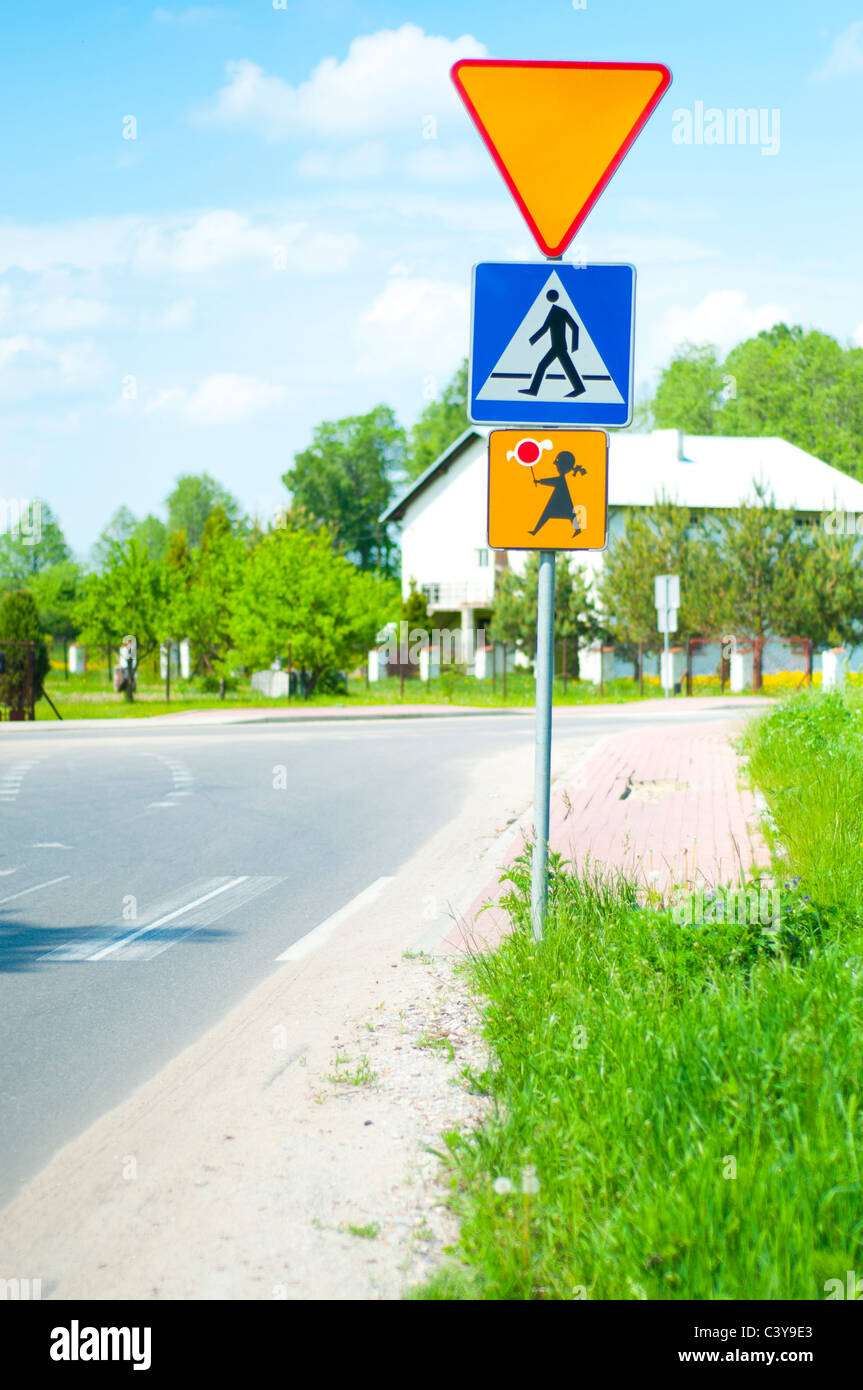 tree road signs, pedestrian crossing Stock Photo - Alamy