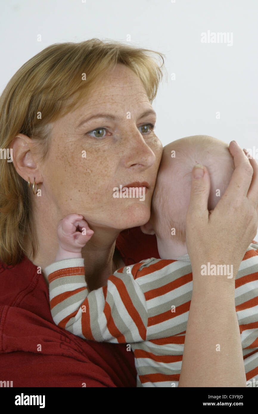 Baby crying mother anxious hi-res stock photography and images - Alamy